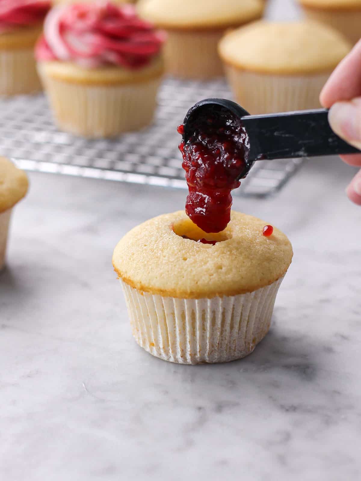 Ultimate Raspberry Almond Cupcakes with Filling - Susan Brings Dessert